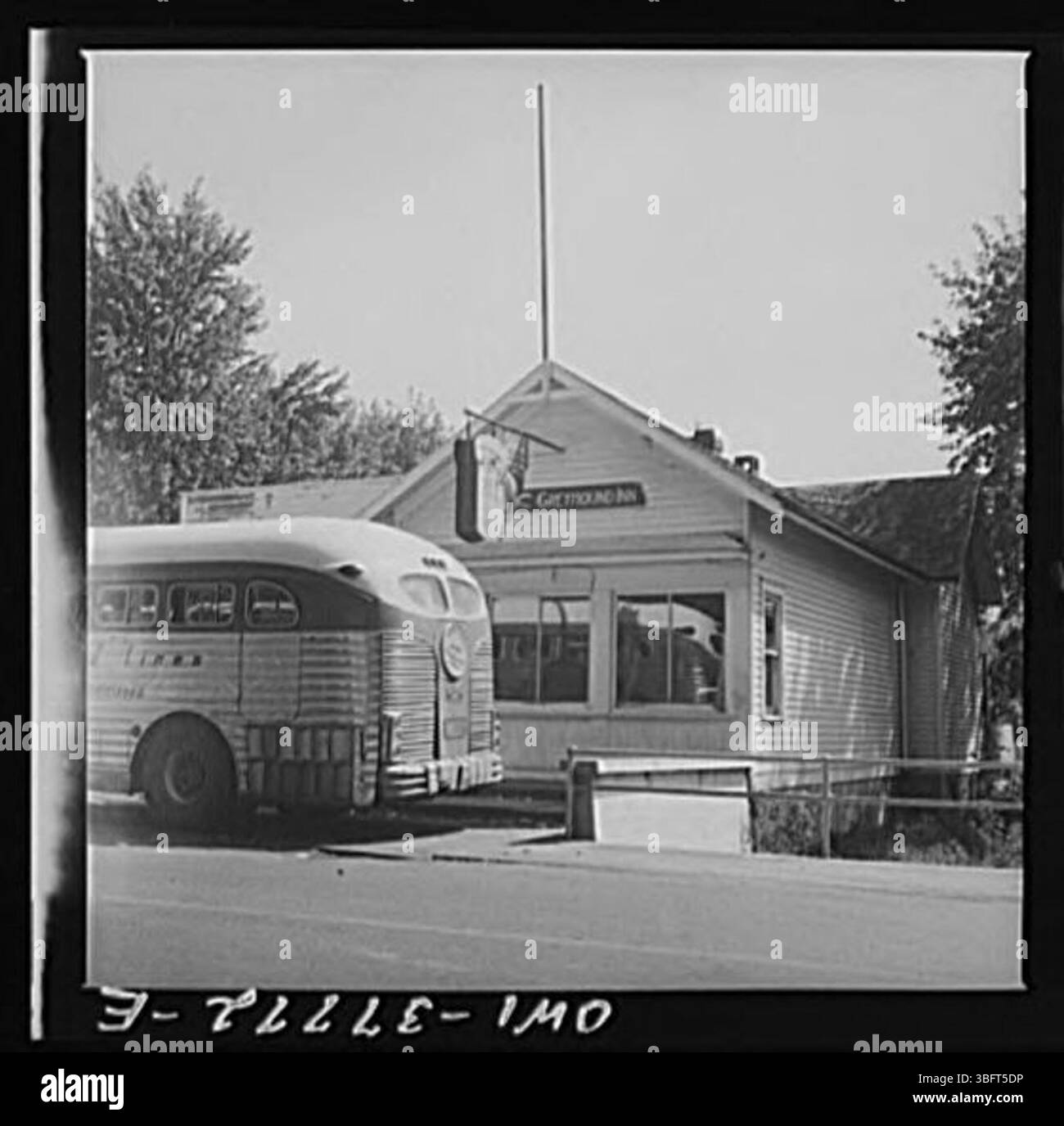 A Greyhound bus at a rest stop in Indiana, capturing the essence of ...