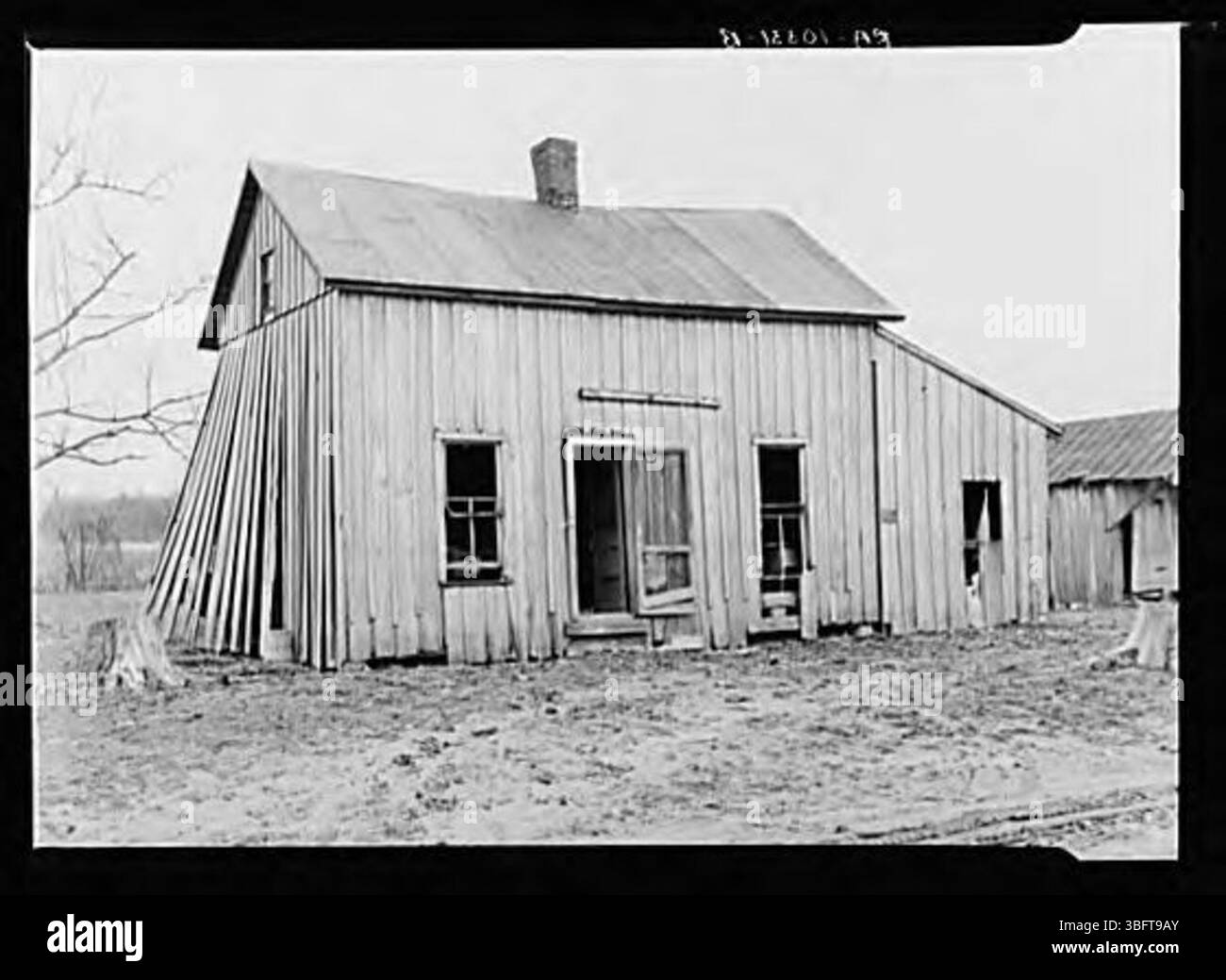 A damaged Indiana farmhouse is shown after a flood, illustrating ...