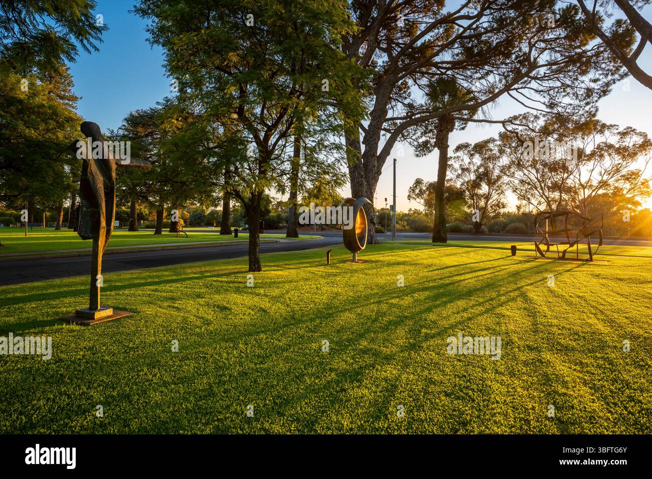 Early morning sunlight on sculptures in the grounds of the Mildura Arts ...