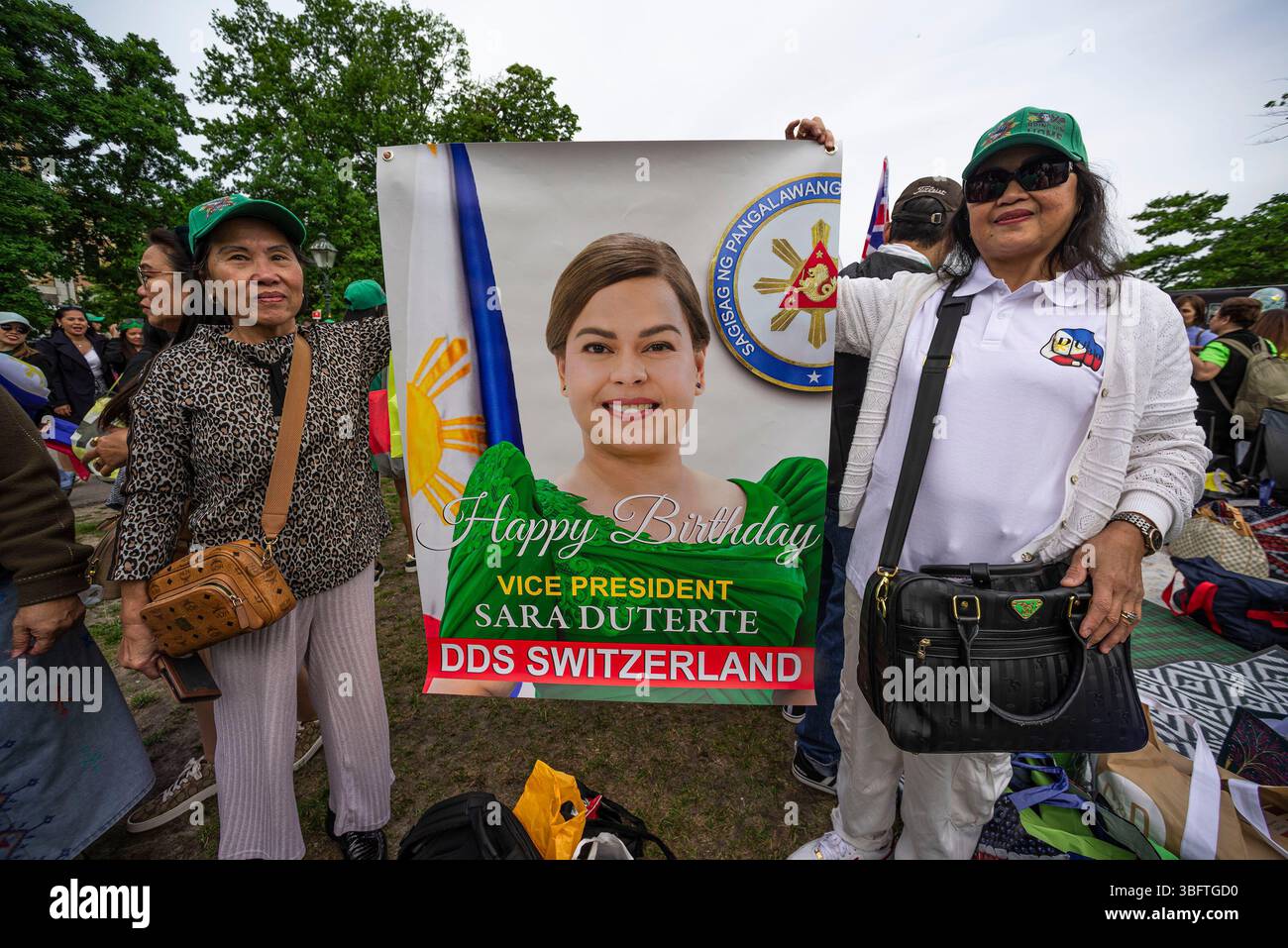 Female supporters of Vice President Sara Duterte hold a banner during a ...