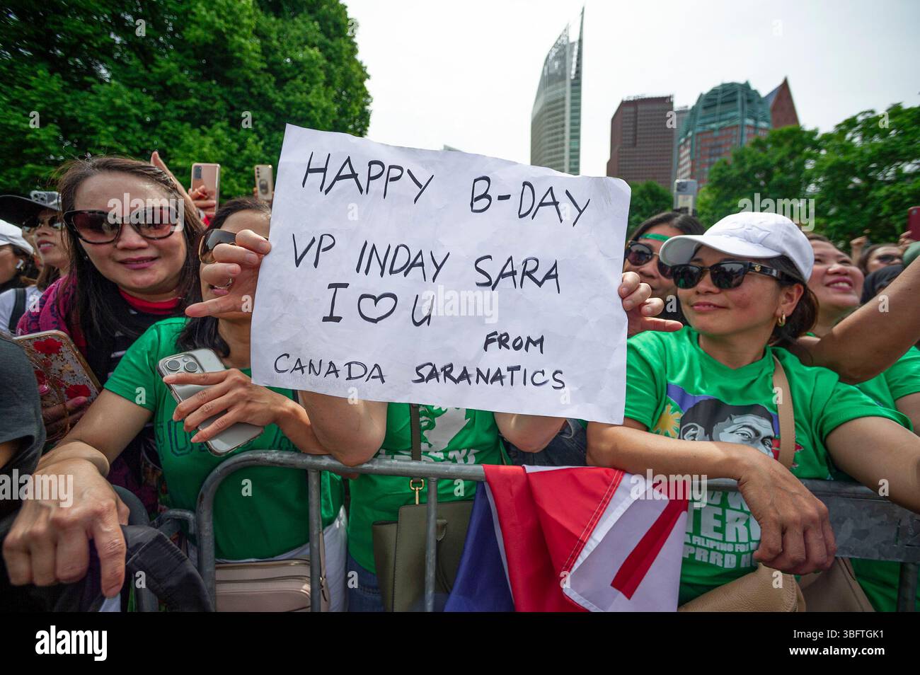 A woman holds a placard expressing her opinion during the rally held on ...