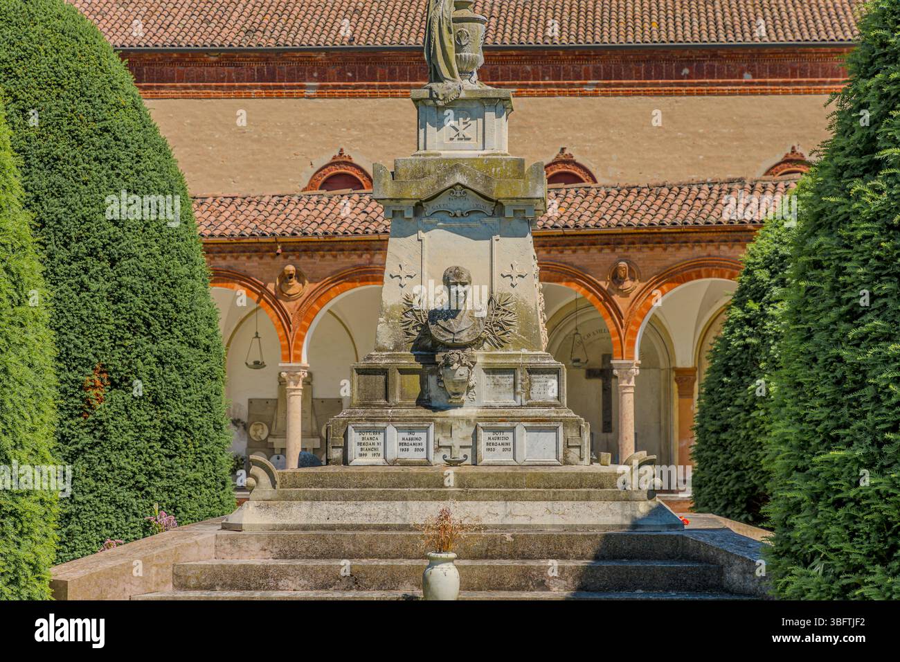 Ferrara, Italy - May 17, 2025: Featuring tombs, statues and small ...
