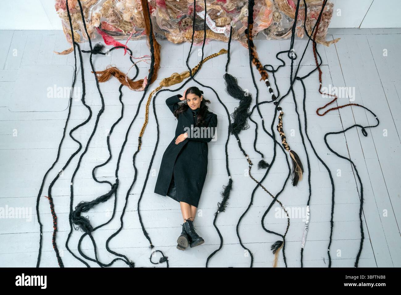 Nidhi Bodana alongside her sculptural installation performance piece ...