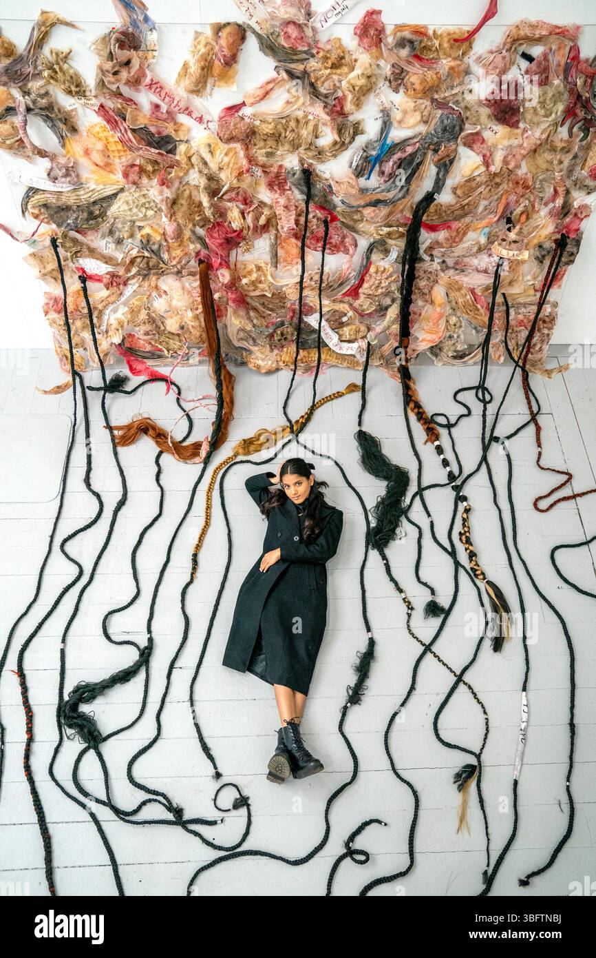Nidhi Bodana alongside her sculptural installation performance piece ...