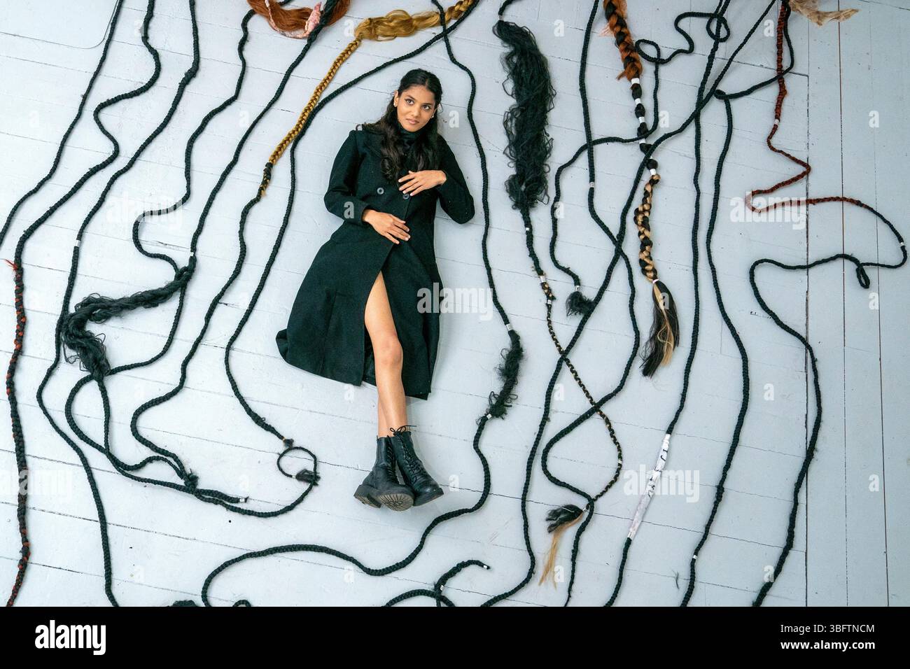 Nidhi Bodana alongside her sculptural installation performance piece ...