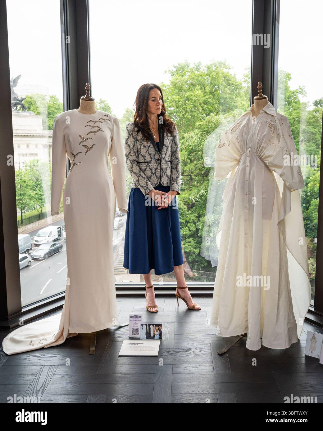 A person views (left) a Princess Diana 1986 Catherine Walker Falcon ...