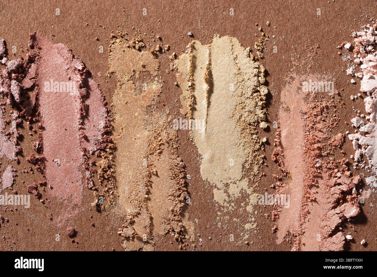 Different eyeshadows smudges on brown background, flat lay Stock Photo ...