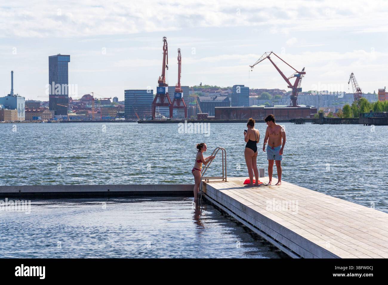 People on floating swimming pools with sauna at Allmanna harbour bath ...