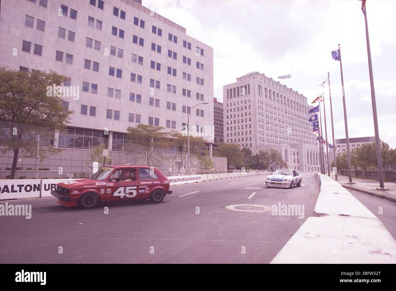 Images from the 1985 Columbus Ford Dealers 500 depict cars racing on ...