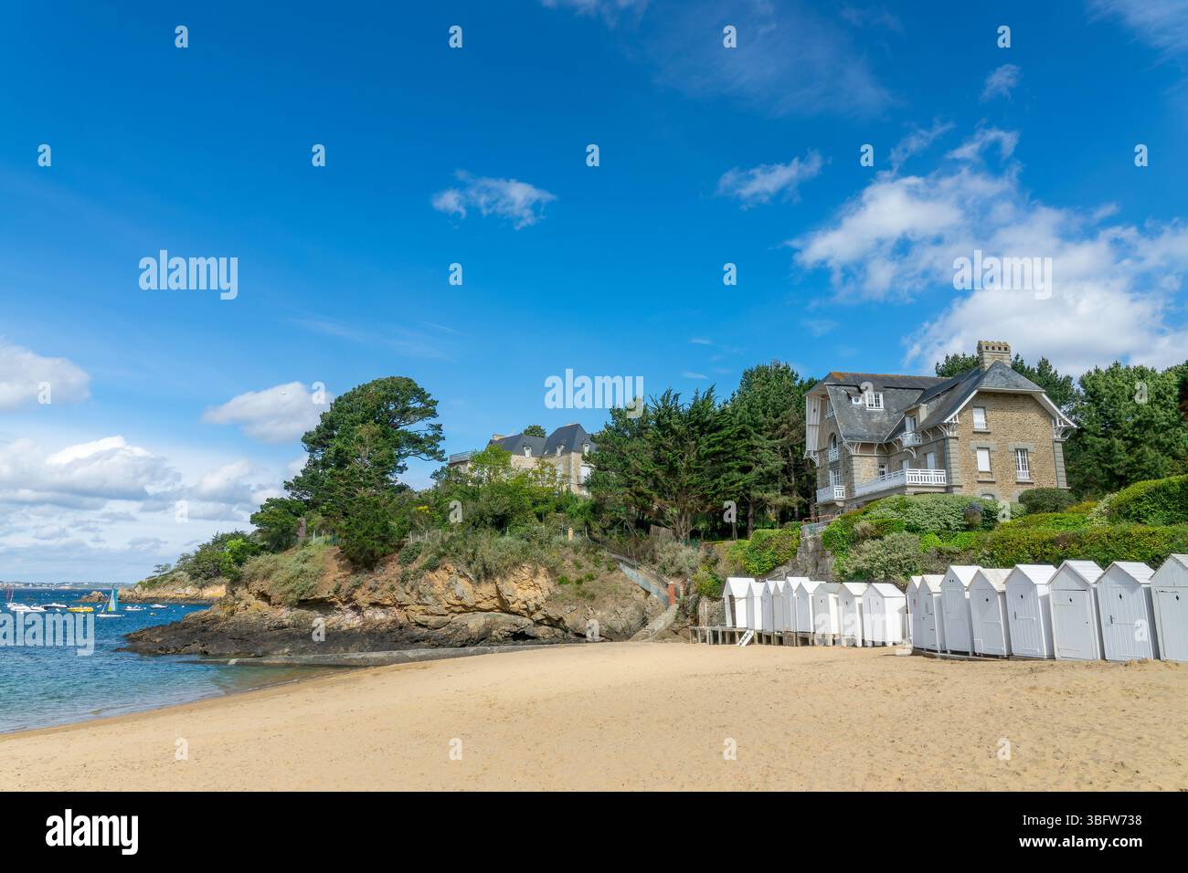 Vintage white beach cabins on Grande Salinette beach in Saint-Briac-sur ...