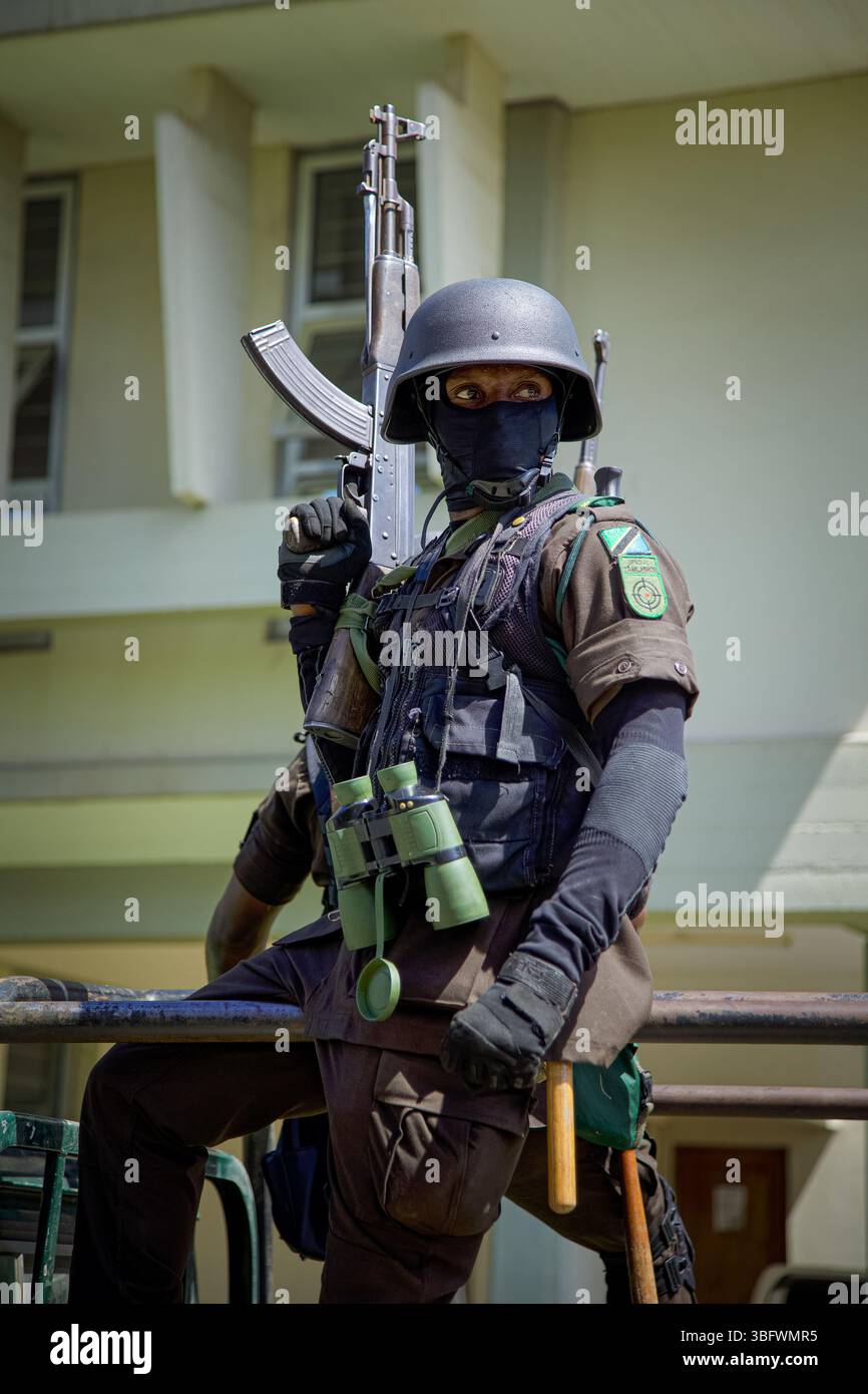 Tanzania police officer stands guarding at the Kisutu magistrate's ...