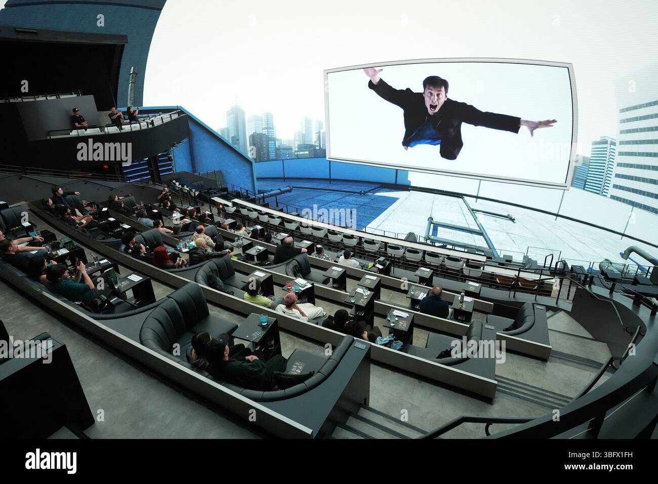 The audience watches a scene from the film "The Matrix" at a screening ...