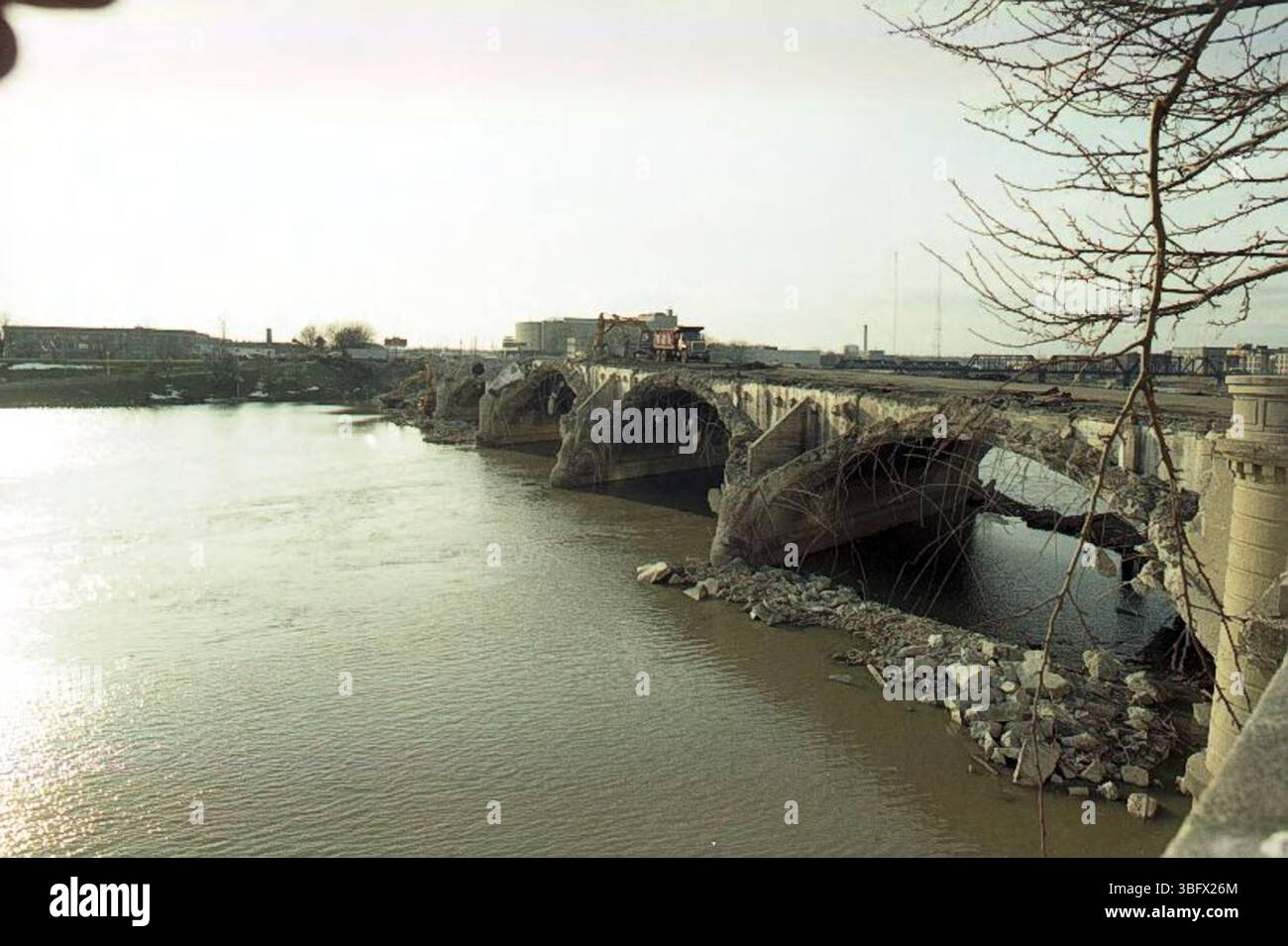 A series of photographs depicting the demolition of the West Broad Street Bridge over the Scioto ...