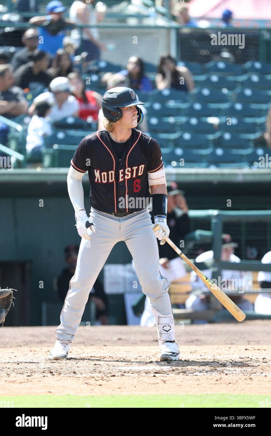 Connor Dykstra (8) of the Modesto Nuts bats against the Inland Empire ...