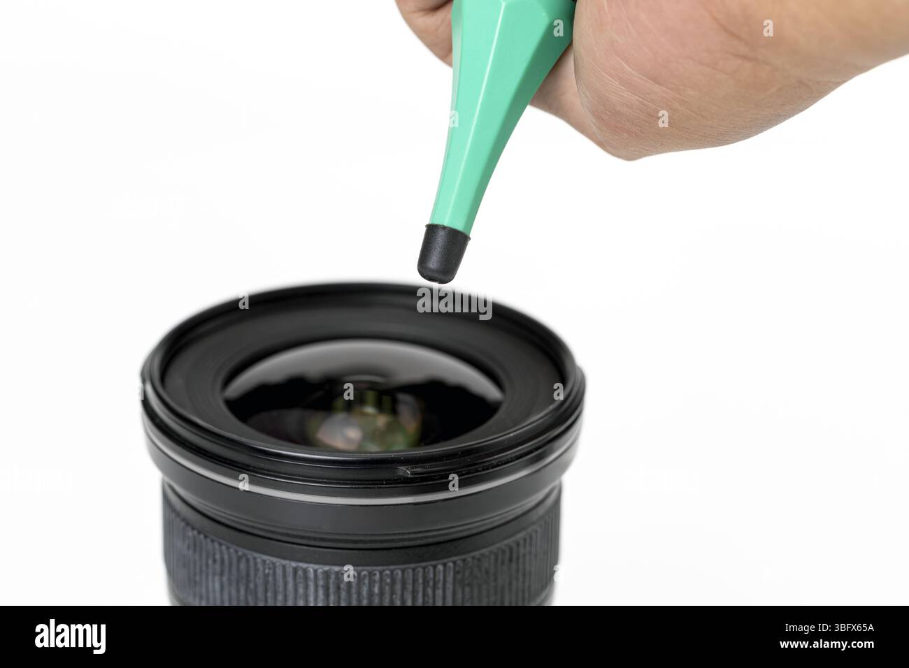 Hand carefully cleans camera lens hi-res stock photography and images ...
