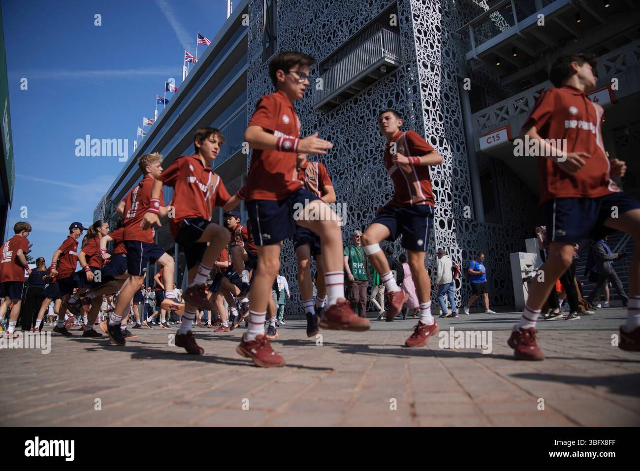 Ball boys and girls warm up for the French Tennis Open at the Roland ...