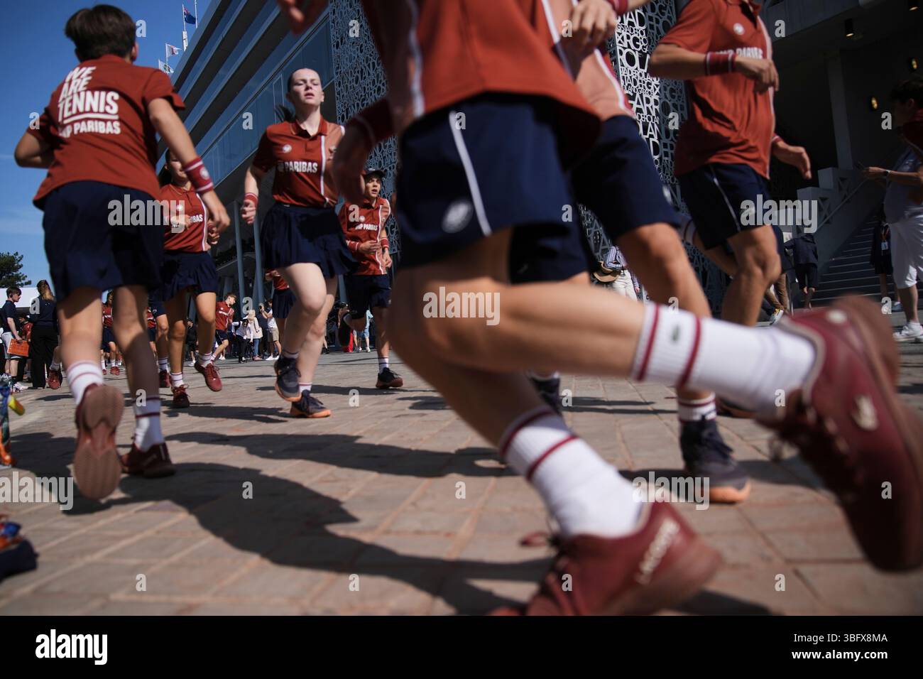 Ball boys and girls warm up for the French Tennis Open at the Roland ...
