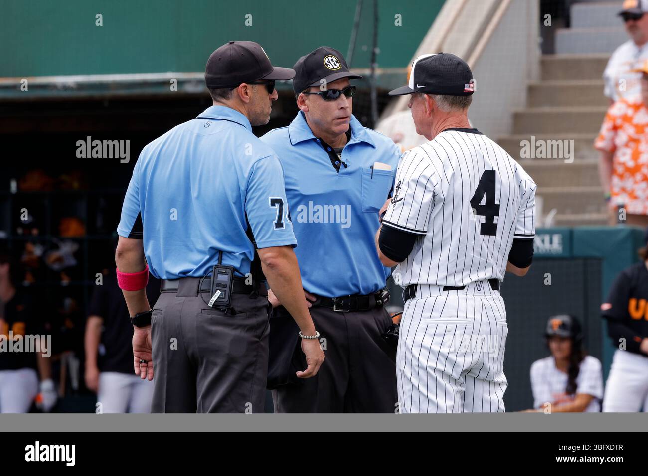 Home plate umpire Kevin Sweeney speaks with Vanderbilt Commodores coach ...