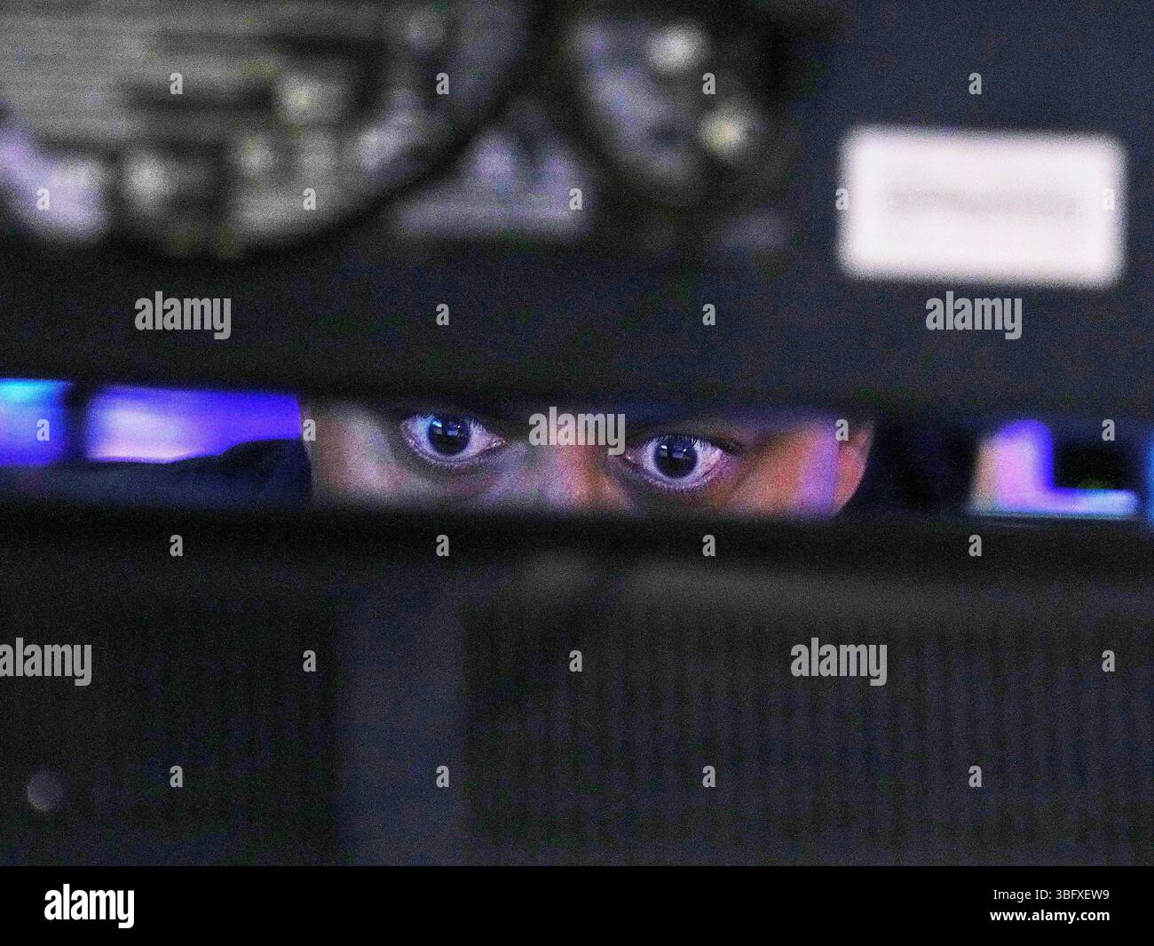 Specialist Dilip Patel works on the floor of the New York Stock ...