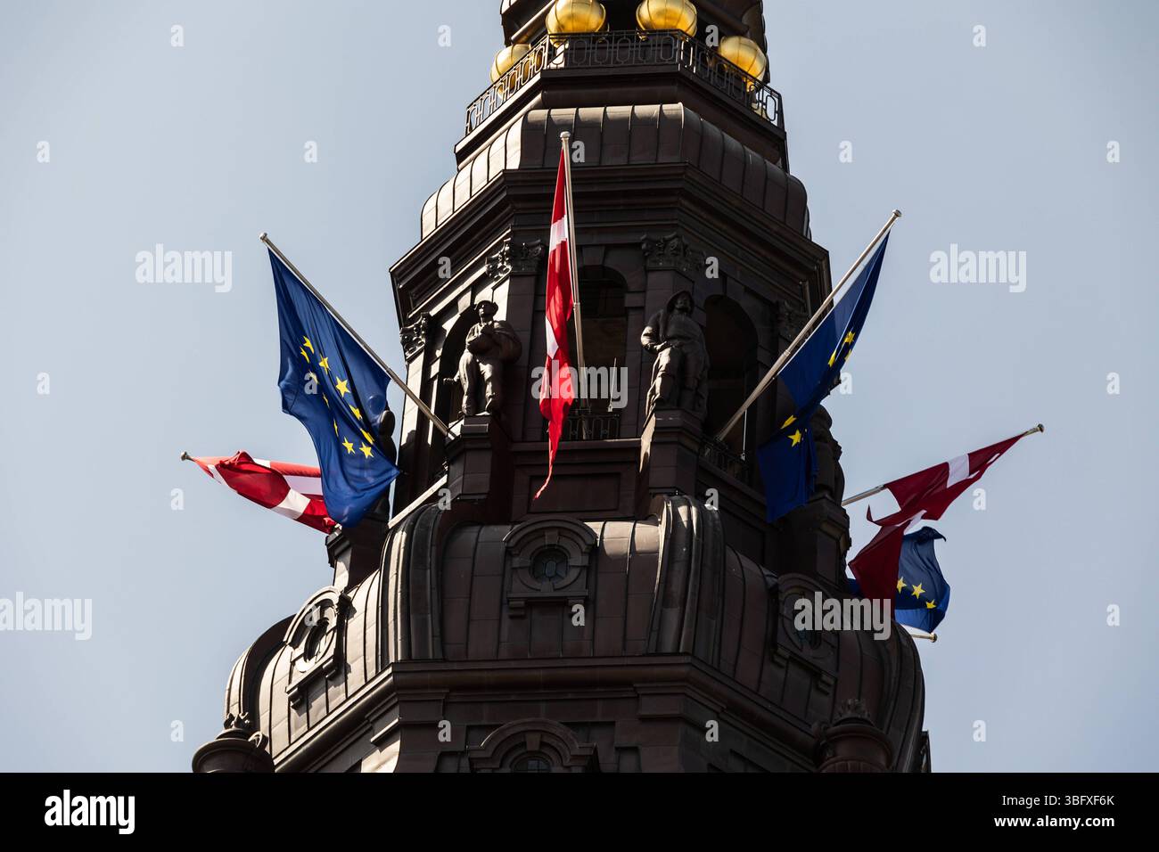 The Danish flag and European Union flag flutter on the tower of ...