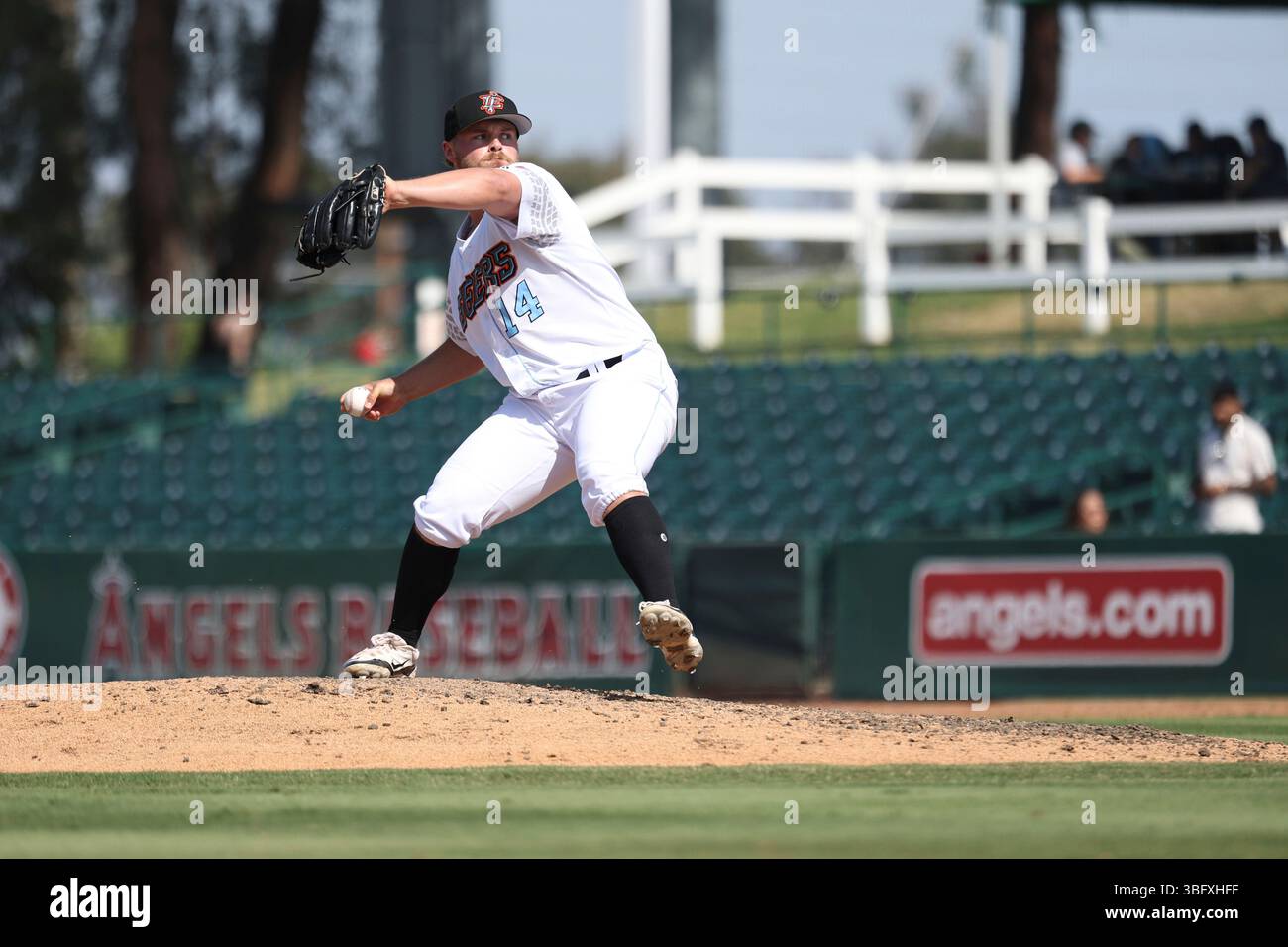 Benny Thompson (14) of the Inland Empire 66ers pitches against the ...