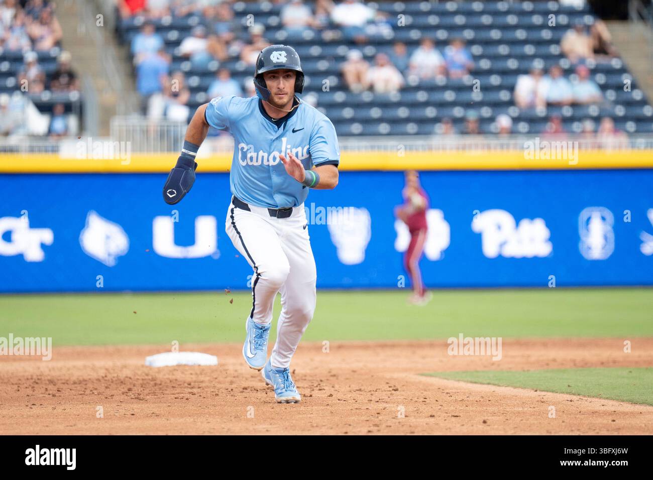 Alex Madera of the University of North Carolina Tar Heels runs to third ...