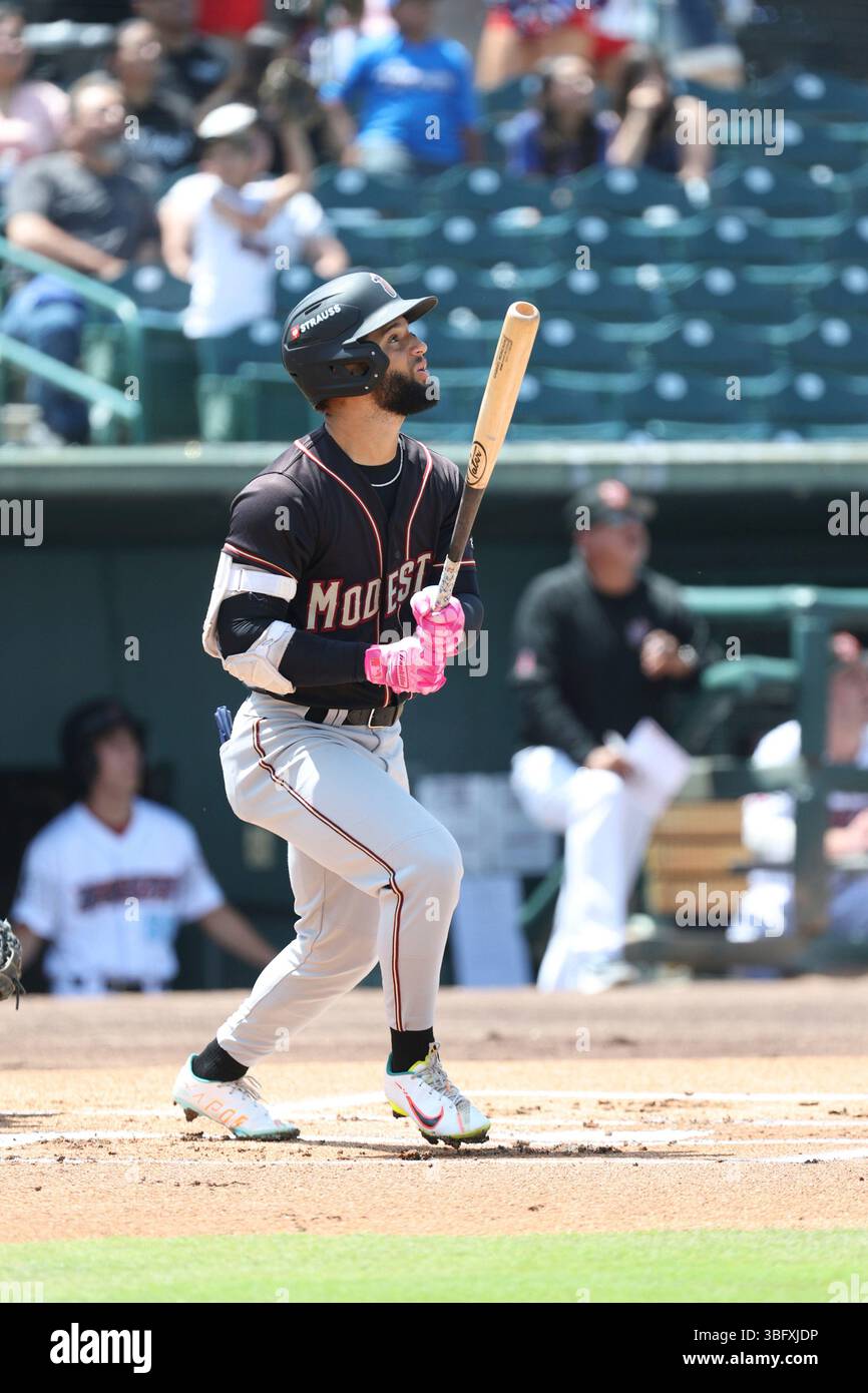 Carlos Jimenez (18) of the Modesto Nuts bats against the Inland Empire ...
