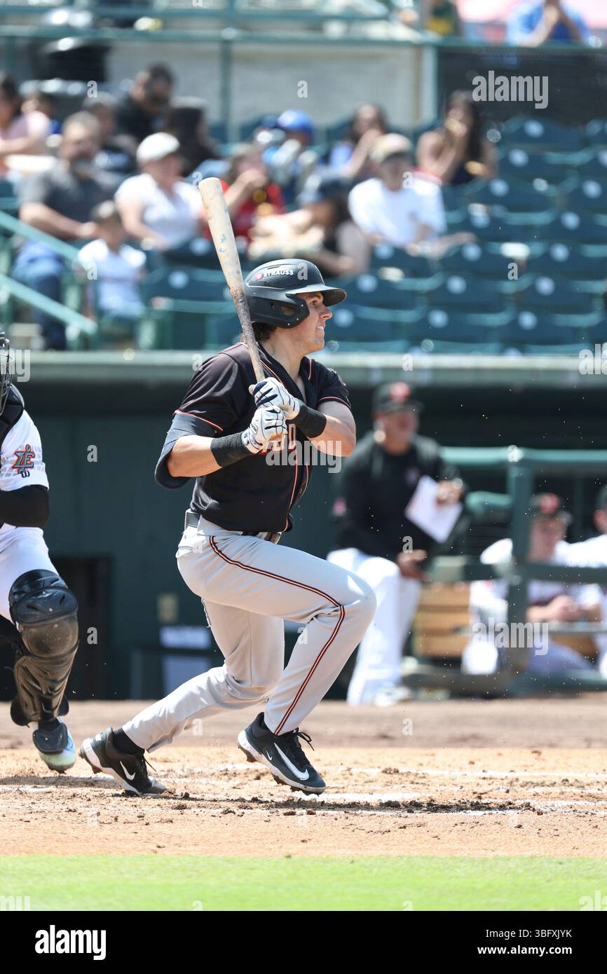Carter Dorighi (10) of the Modesto Nuts bats against the Inland Empire ...
