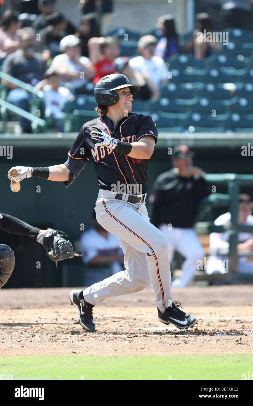 Carter Dorighi (10) of the Modesto Nuts bats against the Inland Empire ...