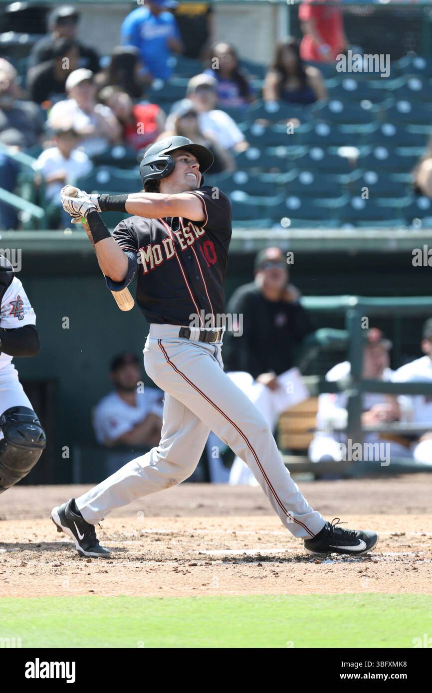 Carter Dorighi (10) of the Modesto Nuts bats against the Inland Empire ...