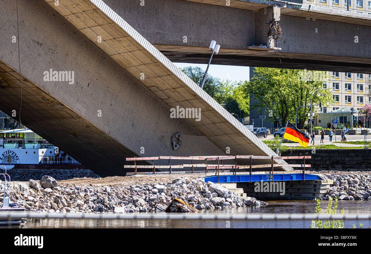 Dresden, Germany, 26th Apr 2025: A flag of Germany blows in the wind ...