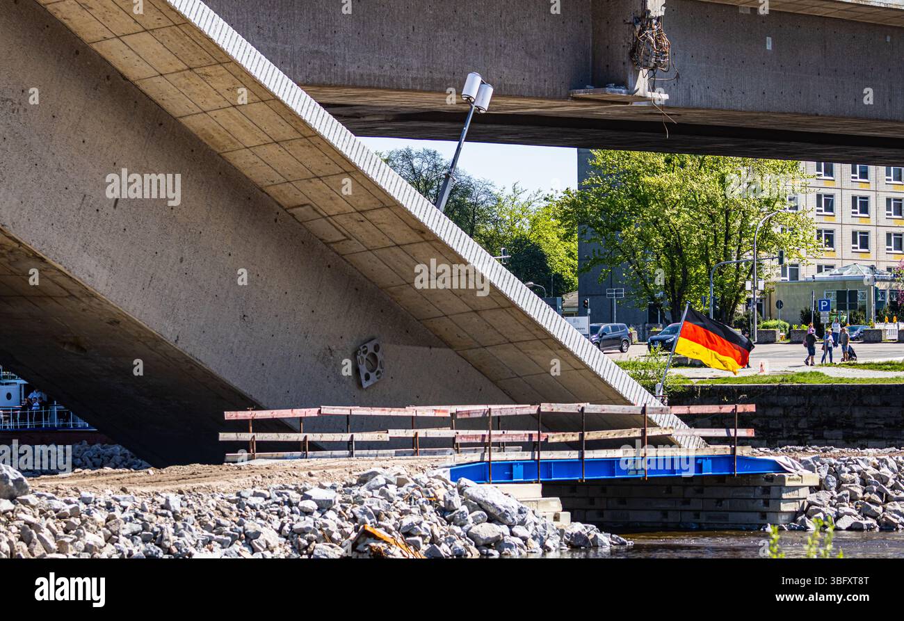 Dresden, Germany, 26th Apr 2025: A flag of Germany blows in the wind ...