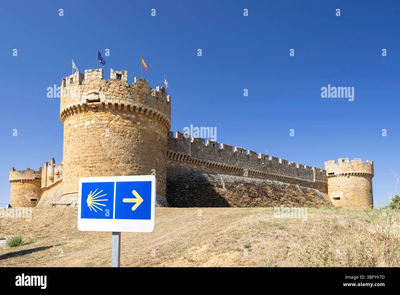 Medieval castle of Grajal de Campos with Camino de Santiago sign ...