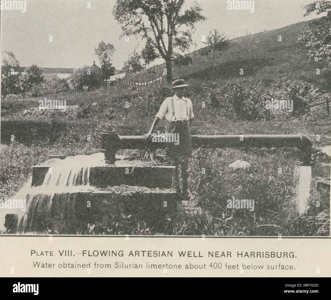 This photograph shows a flowing artesian well near Harrisburg, where ...
