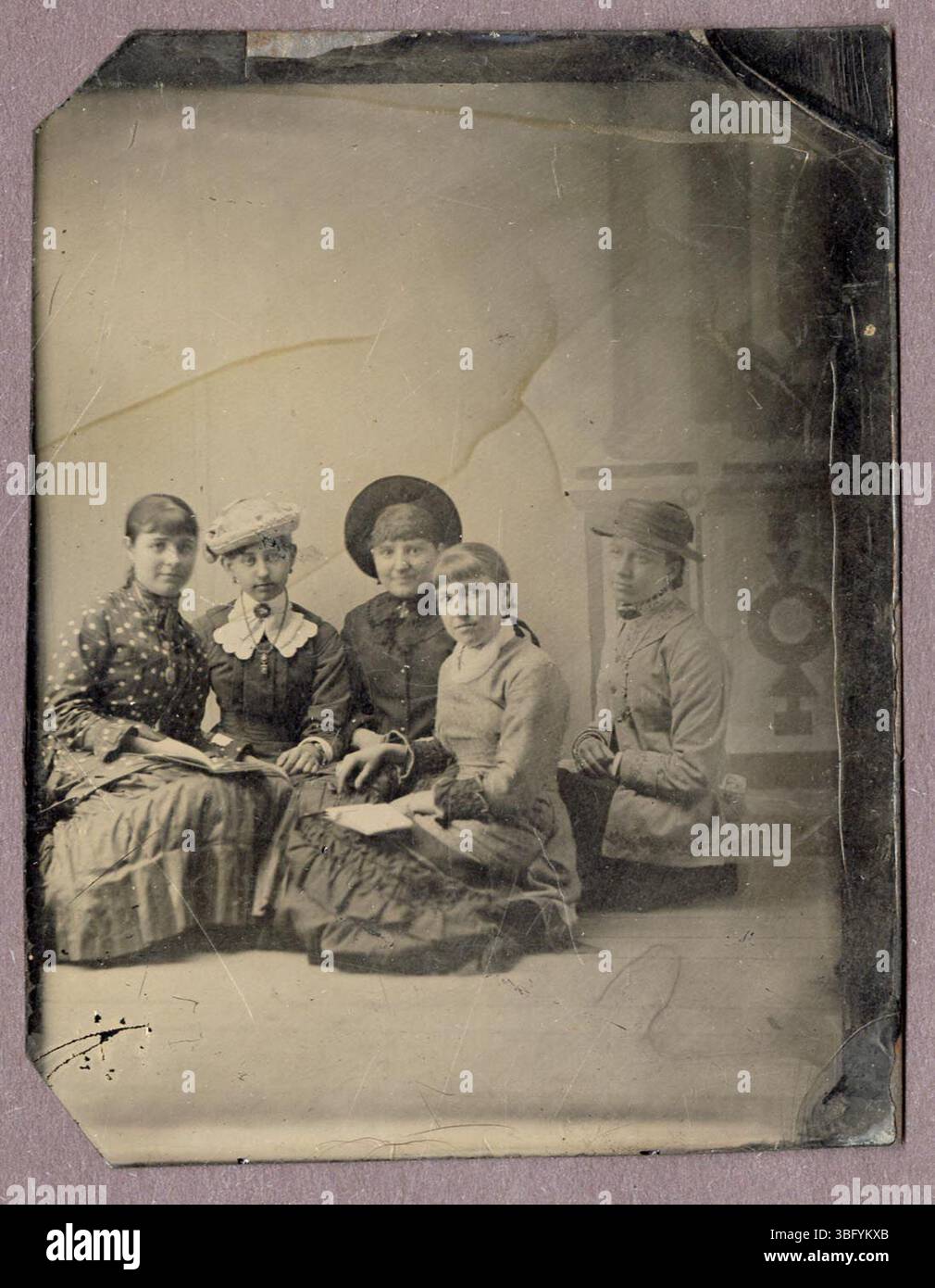 This circa 1870 group portrait features five young women seated ...