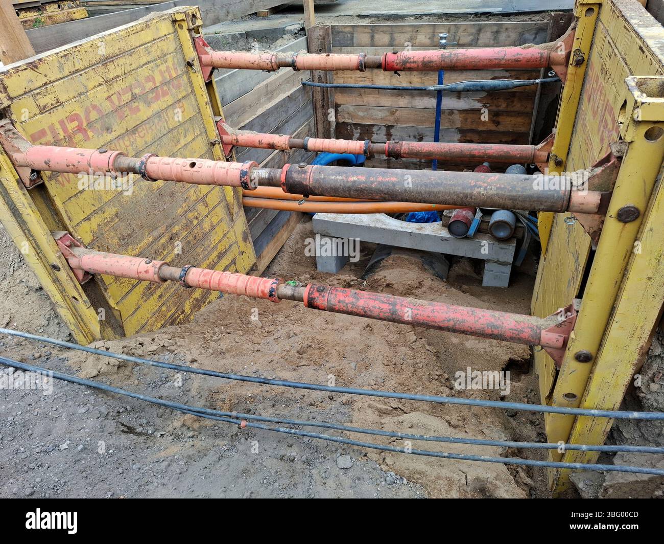 Berlin, Germany - May 16, 2025: View into a supported construction trench of the water supply ...