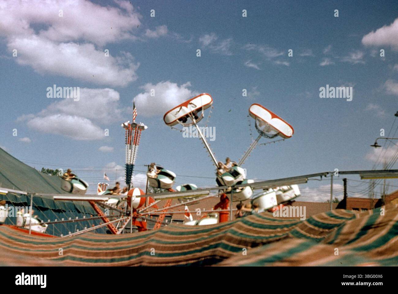 Photograph taken by A.V. Shirk around 1955 showing a carnival ride at ...