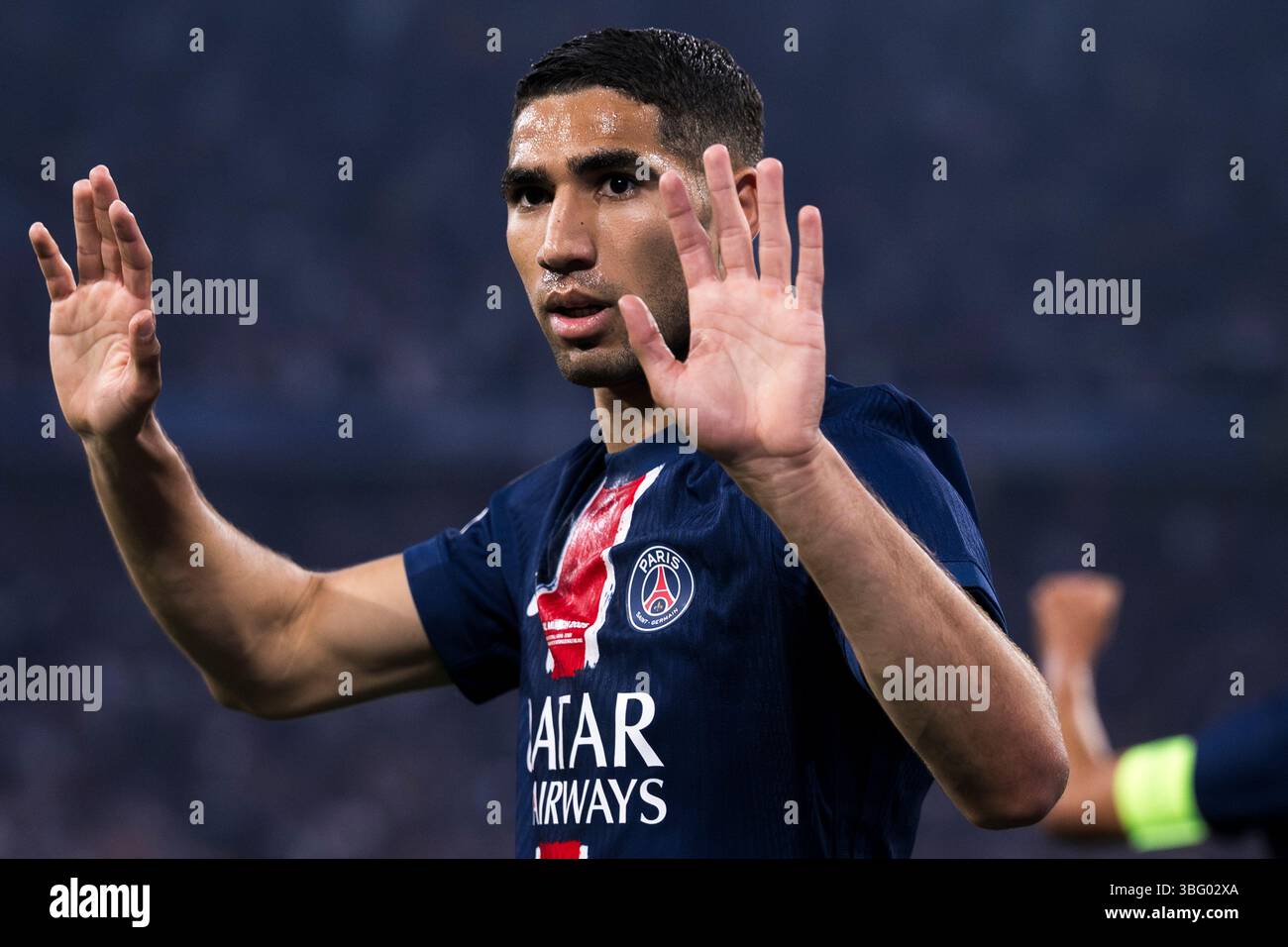 Achraf Hakimi of Paris Saint-Germain reacts after scoring the opening ...