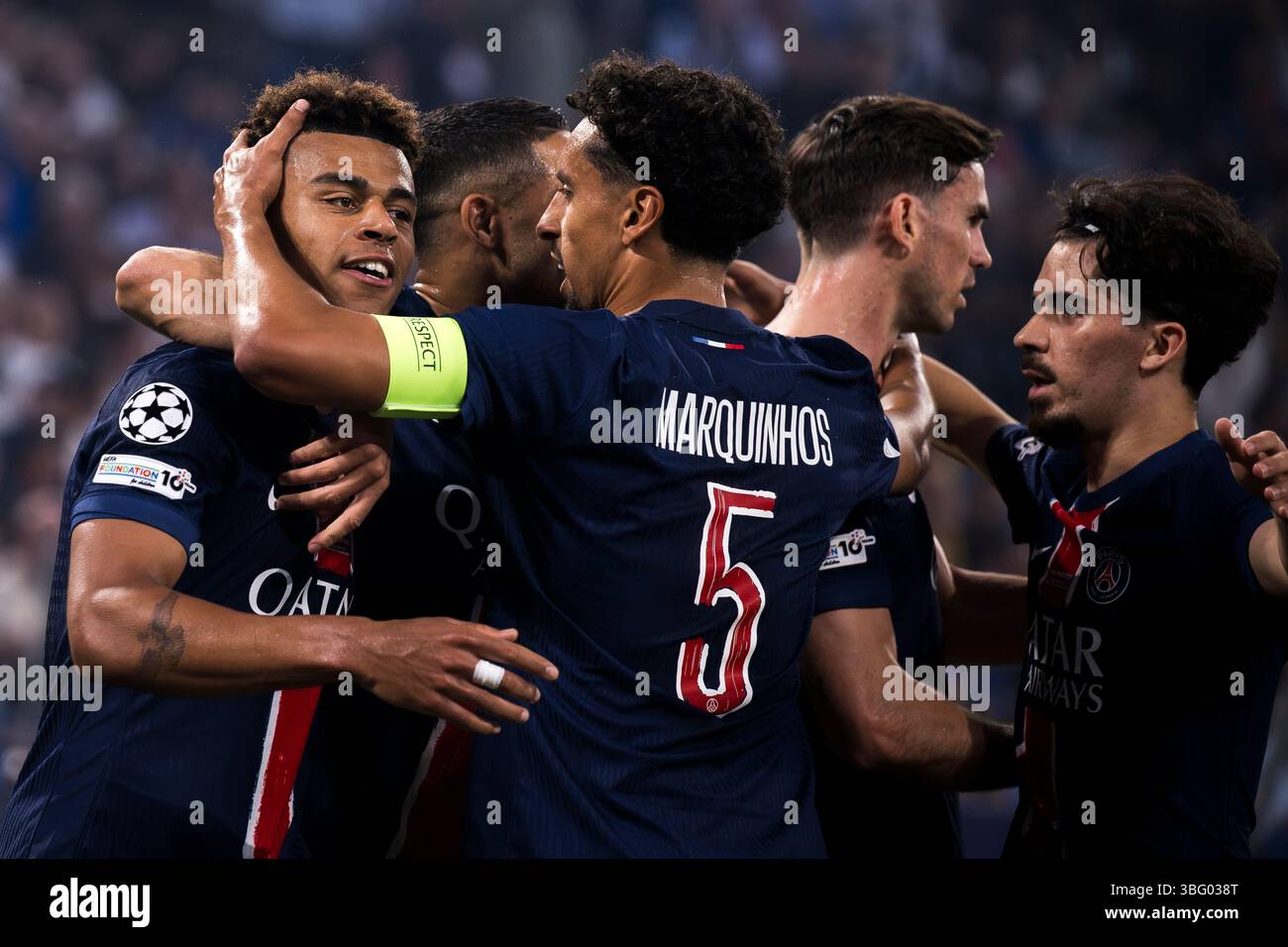 Desire Doue of Paris Saint-Germain celebrates with teamamtes after ...