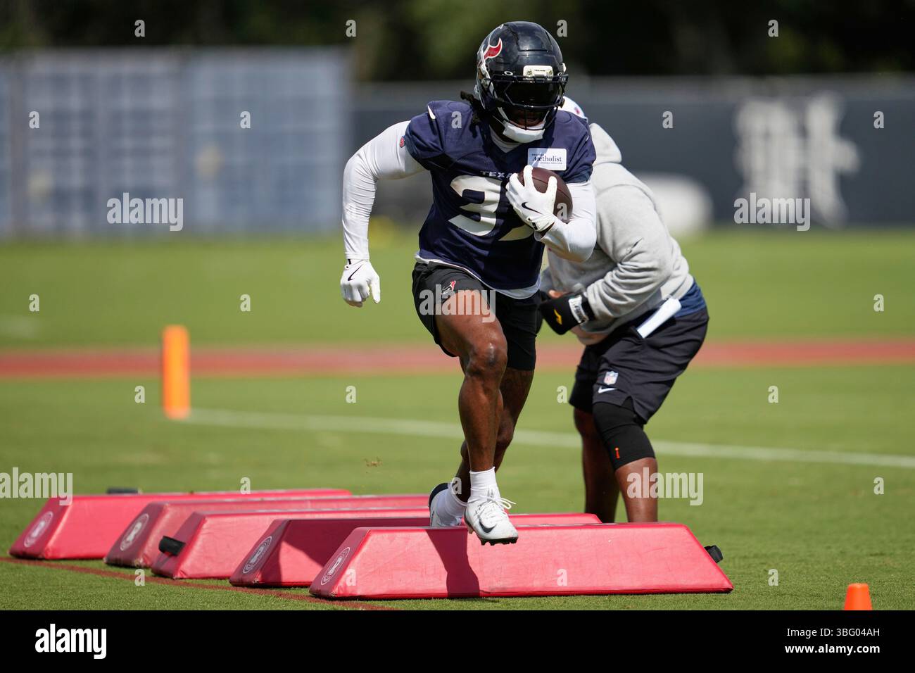 Houston Texans running back Dare Ogunbowale (33) works out during NFL ...