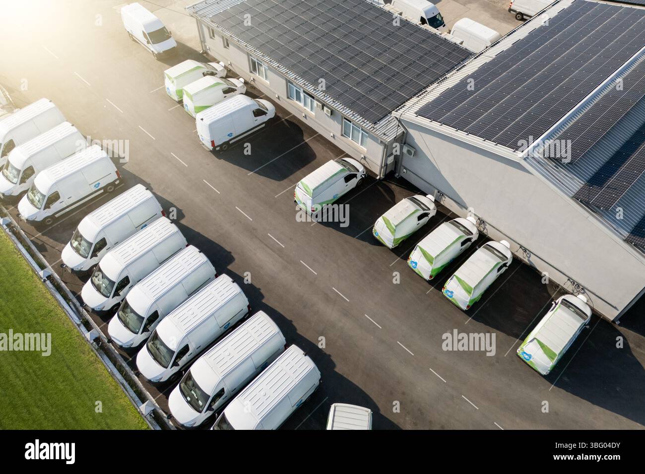 Electric delivery vans hub. Fleet of electric vehicles Stock Photo - Alamy
