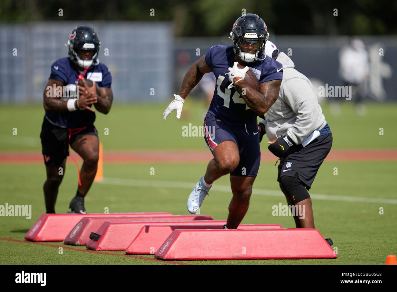 Houston Texans running back Woody Marks, left, and running back British ...