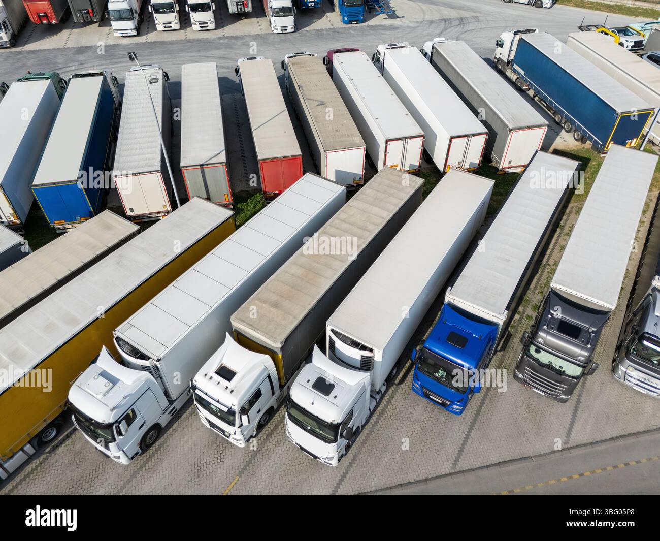 Aerial view of a large truck parking lot at a logistics hub, with ...