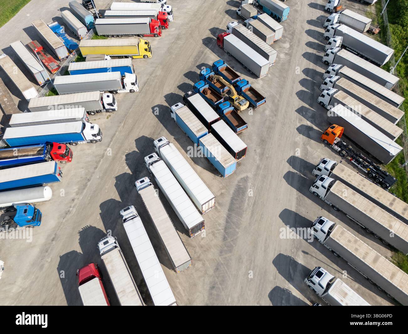 Aerial view of a large truck parking lot at a logistics hub, with ...