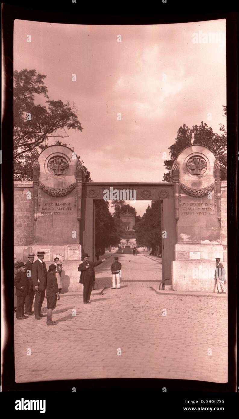 A man gestures toward the Père Lachaise Cemetery gate in Paris. The ...
