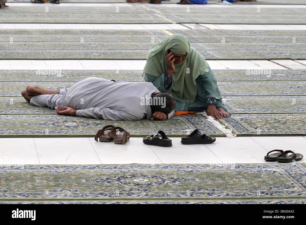 Muslim pilgrims take a nap at the Grand Mosque, during the annual Hajj ...