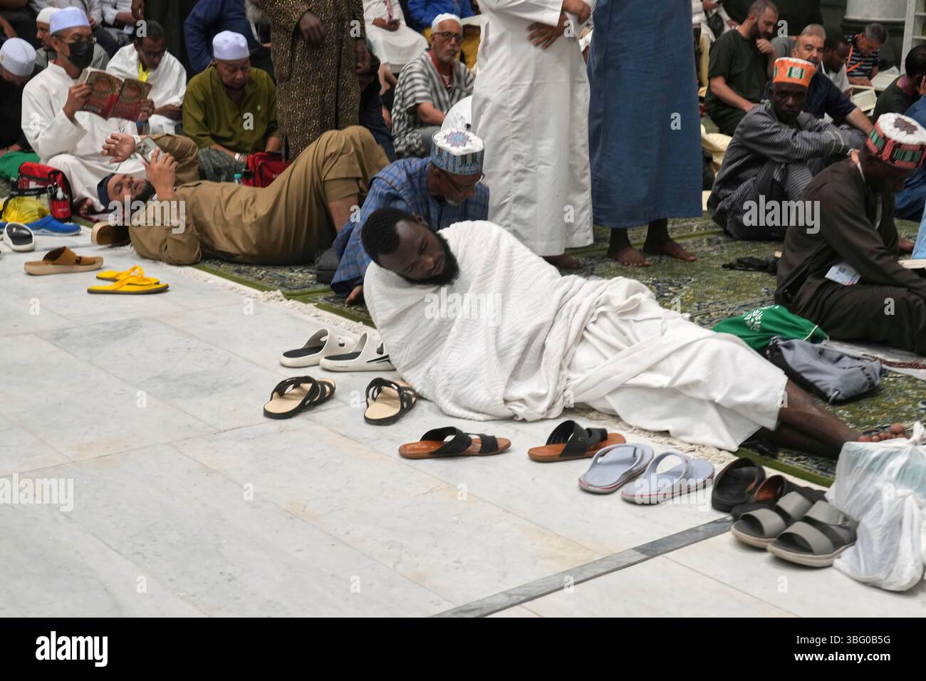 Muslim pilgrims take a nap at the Grand Mosque, during the annual Hajj ...