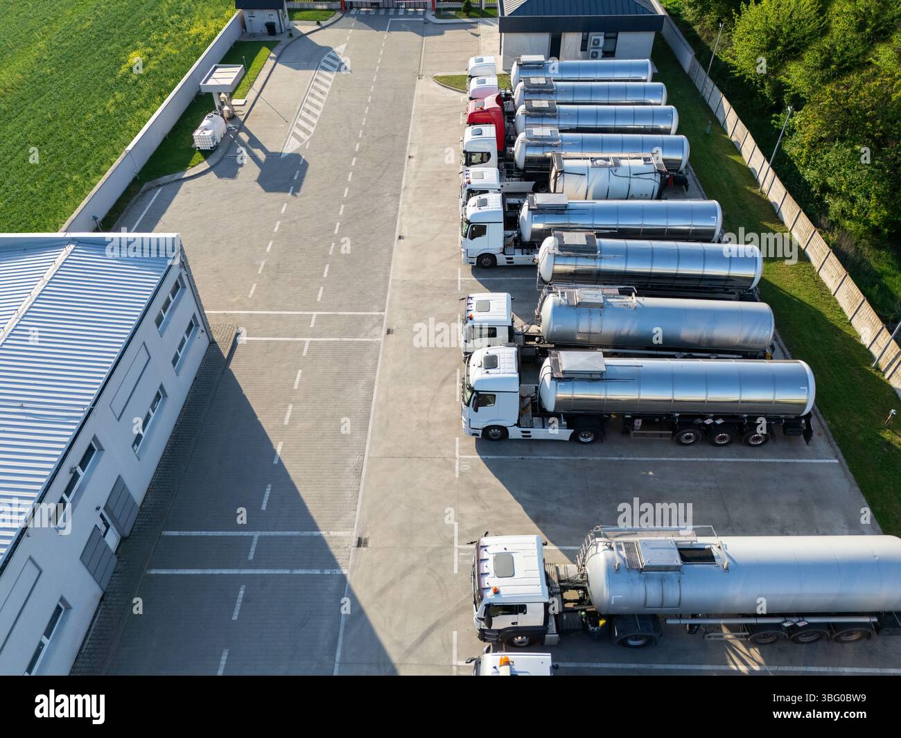 Fleet of trucks with tank trailers Stock Photo - Alamy