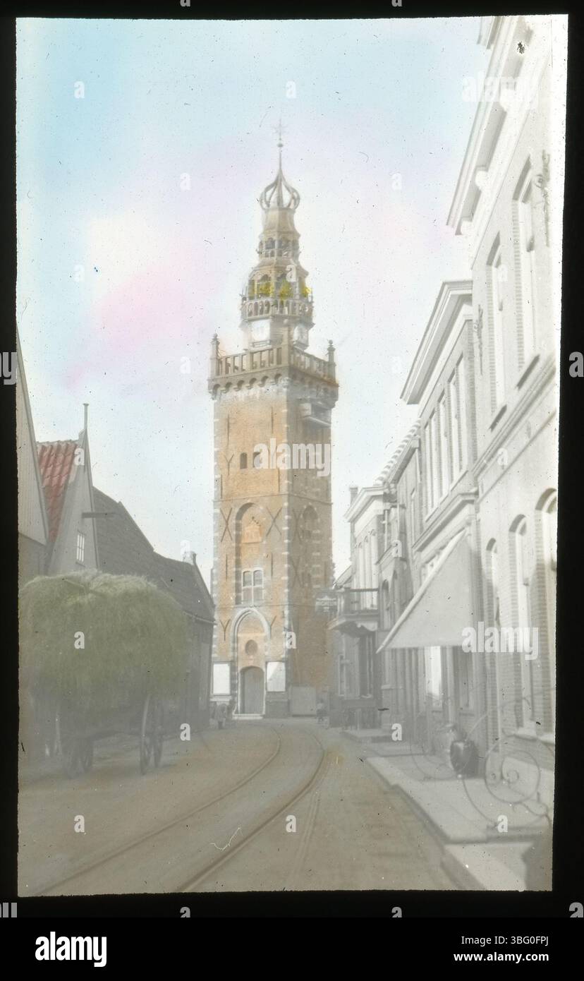 A 1913 photograph of a tall, ornate clock tower in Monnickendam ...