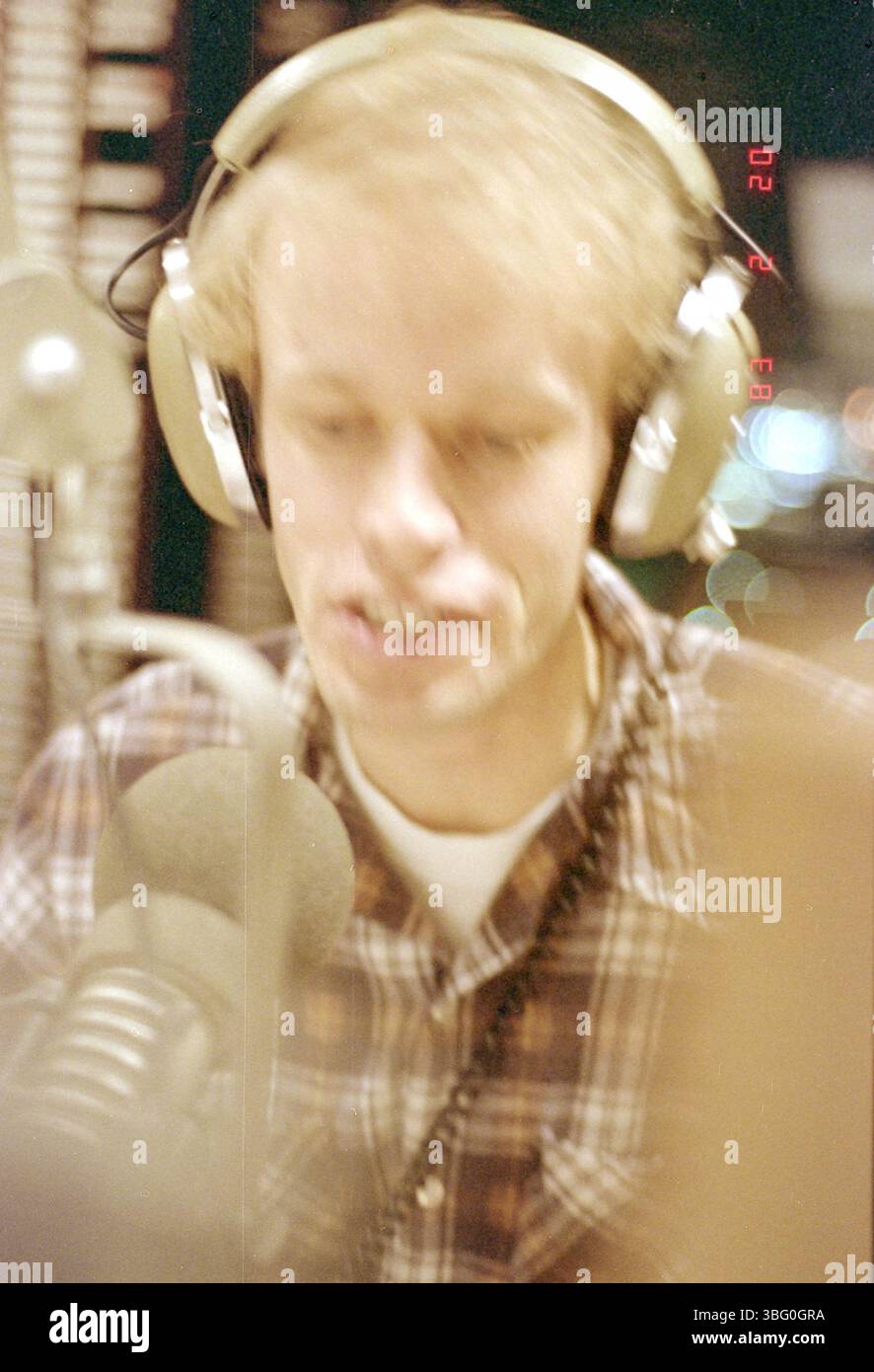DJ Kent Jones speaking into the microphone at WTVN radio in 1983. Known ...